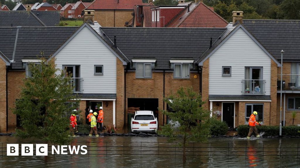 Heavy rain brings flooding and travel disruption - BBC News