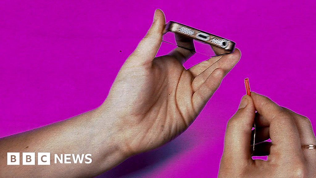 Using a paper clip to clean headphone sockets