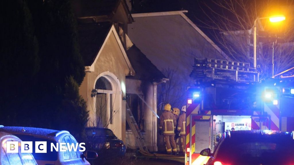 Ballymena fire: Firefighters rescue woman from burning house - BBC News