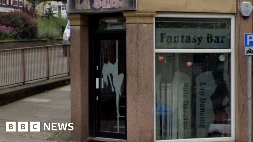 Lap dancing club told to cover up advertising - BBC News