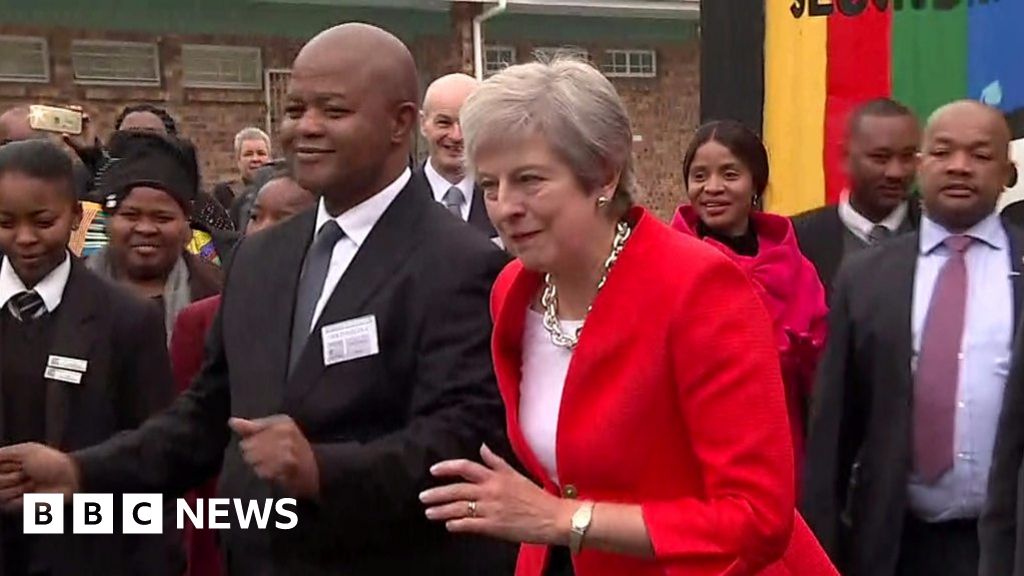 Theresa May dons her dancing shoes in SA - BBC News