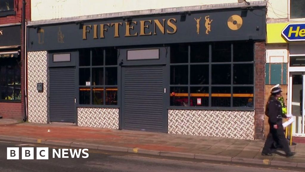 Man charged over woman's road death outside Wigan bar - BBC News