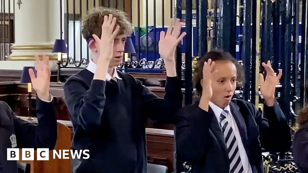 Royal School for the Deaf Derby signs national anthem with choir - BBC News