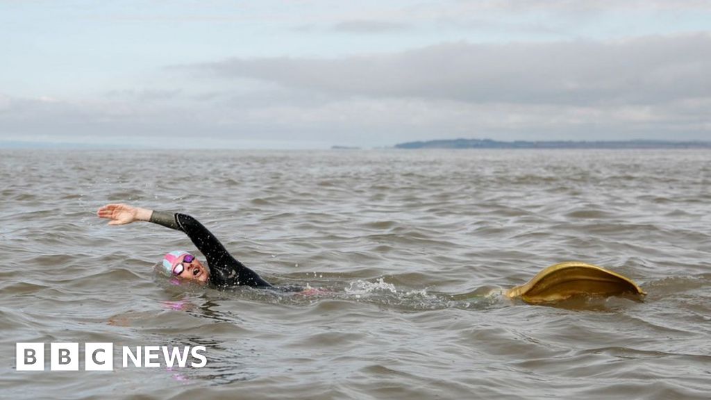 Woman completes Bristol channel swim in mermaid's tail - BBC News