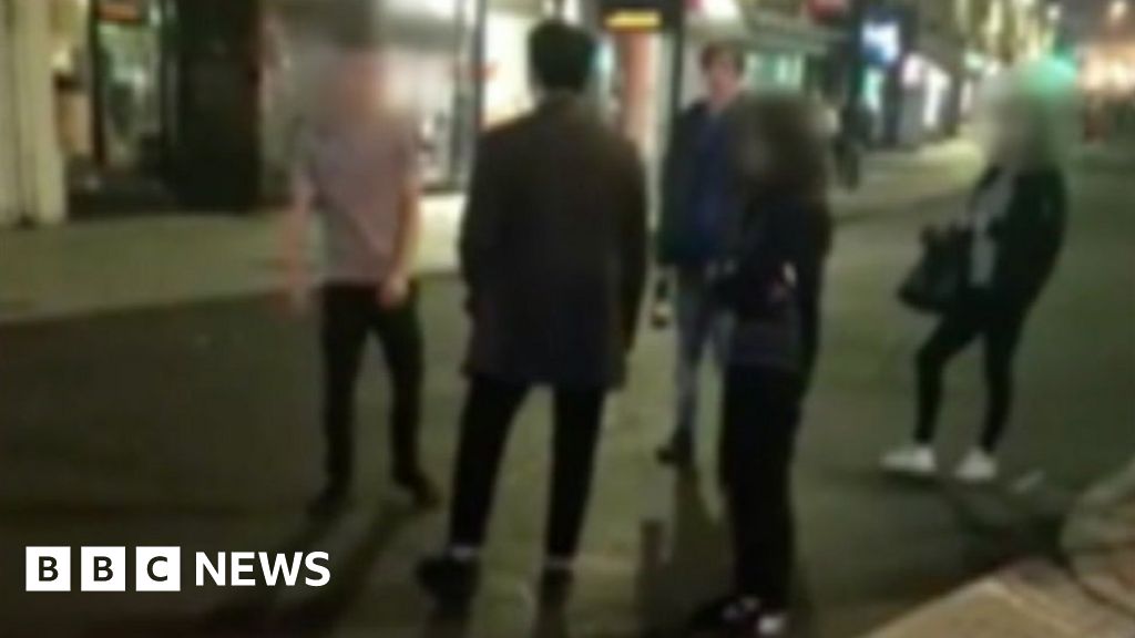 Two held over 'racist' bottle attack in Brighton - BBC News