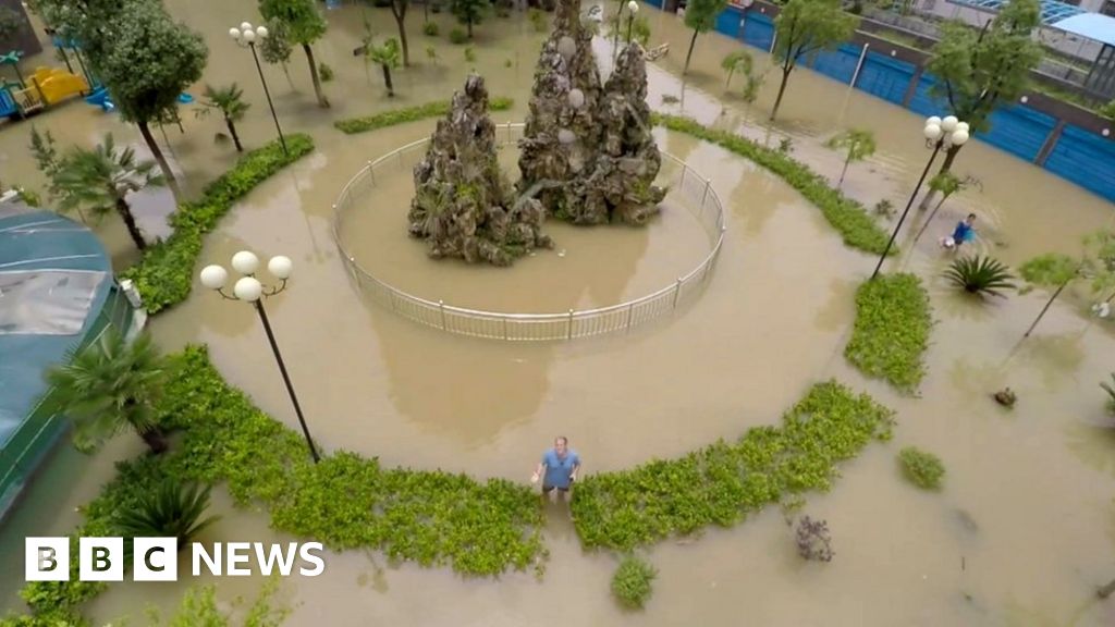 China floods: Inside a housing estate submerged by water - BBC News