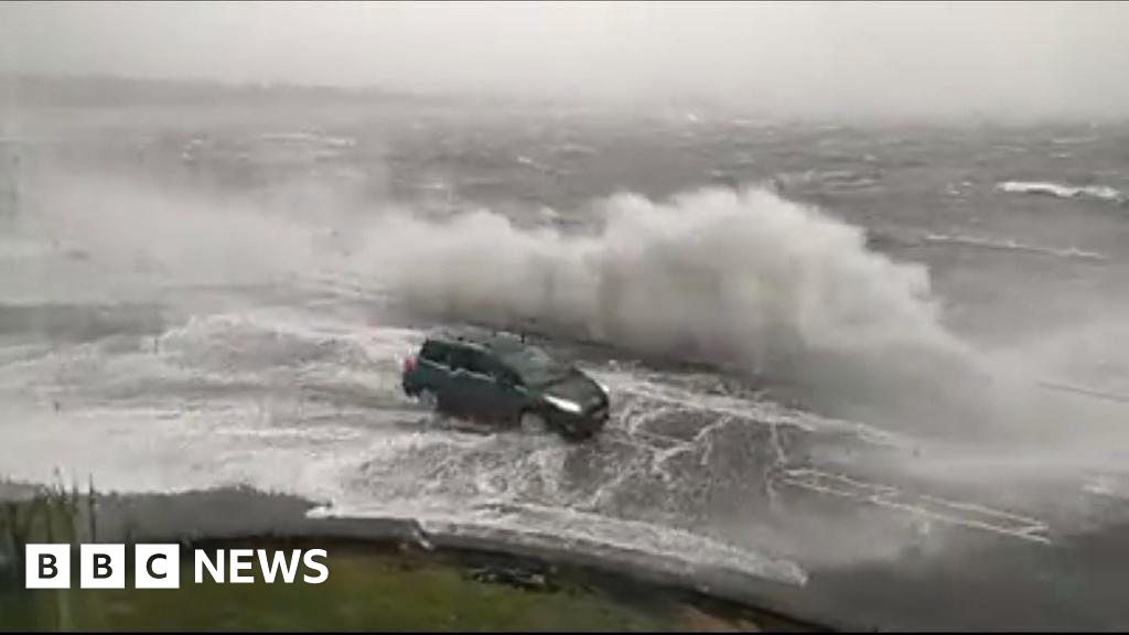 Waves crash over cars on A83 as Storm Brendan hits