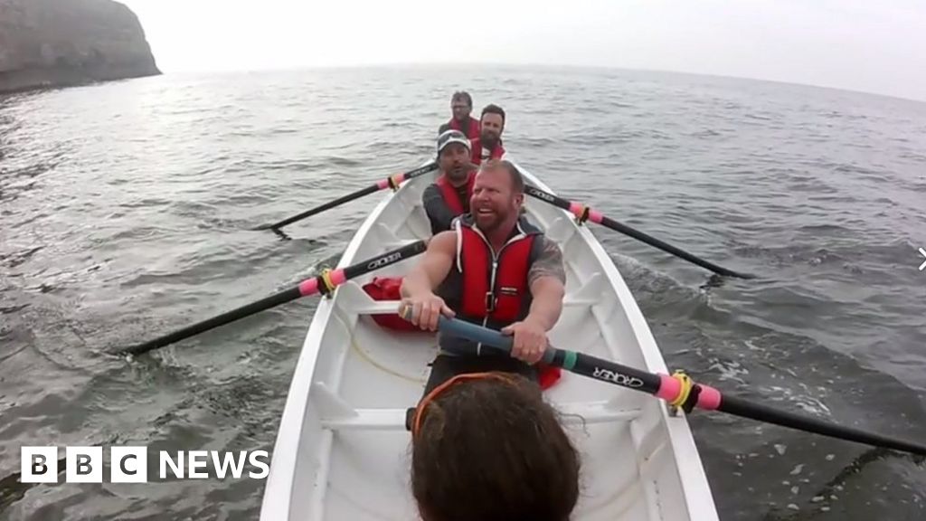 Fundraisers complete Isle of Man to Wales rowing challenge - BBC News
