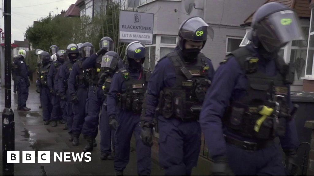 Police raid home of vaccine text fraudster - BBC News