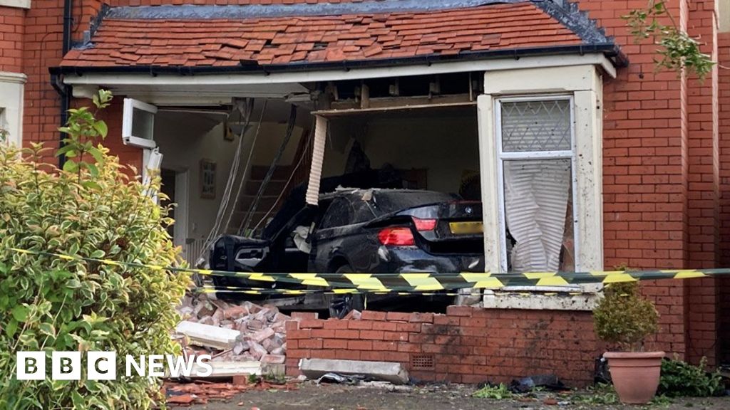 Poulton car crash: BMW crashes into house and stops in lounge