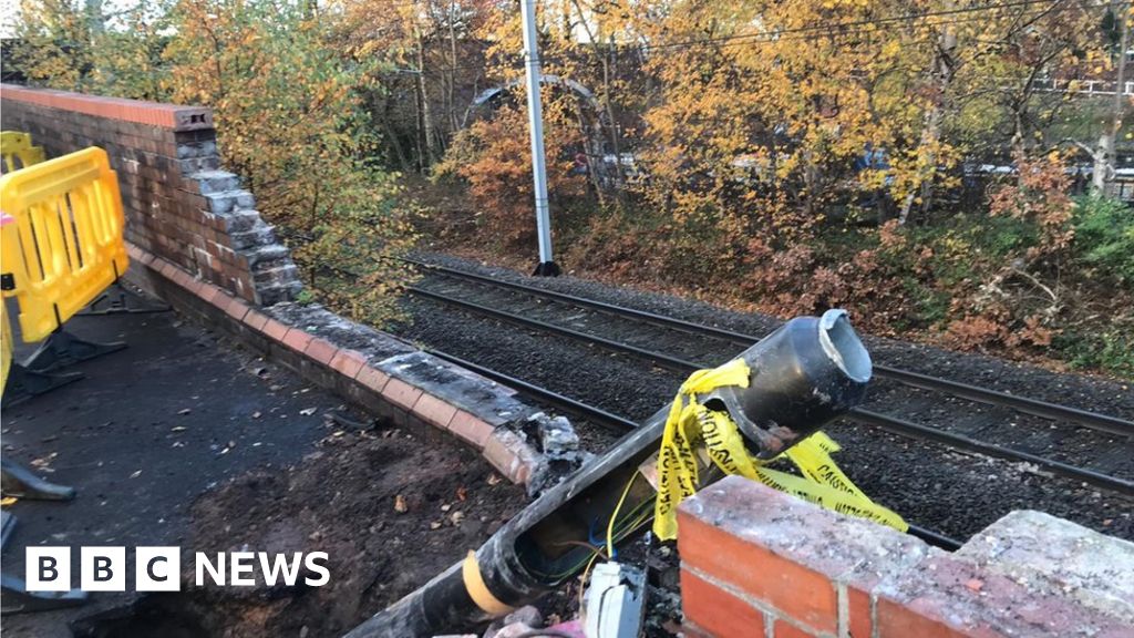 Two injured after van crashes on to Sale tram tracks - BBC News