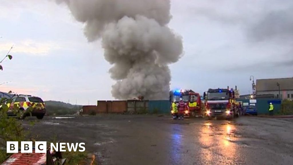 Fire burns at metal scrap yard in Skewen, Neath Port Talbot - BBC News