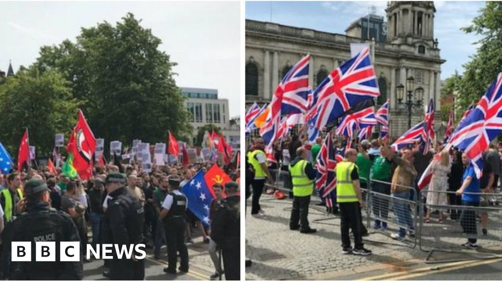 Smoke bombs thrown during Belfast demonstrations - BBC News
