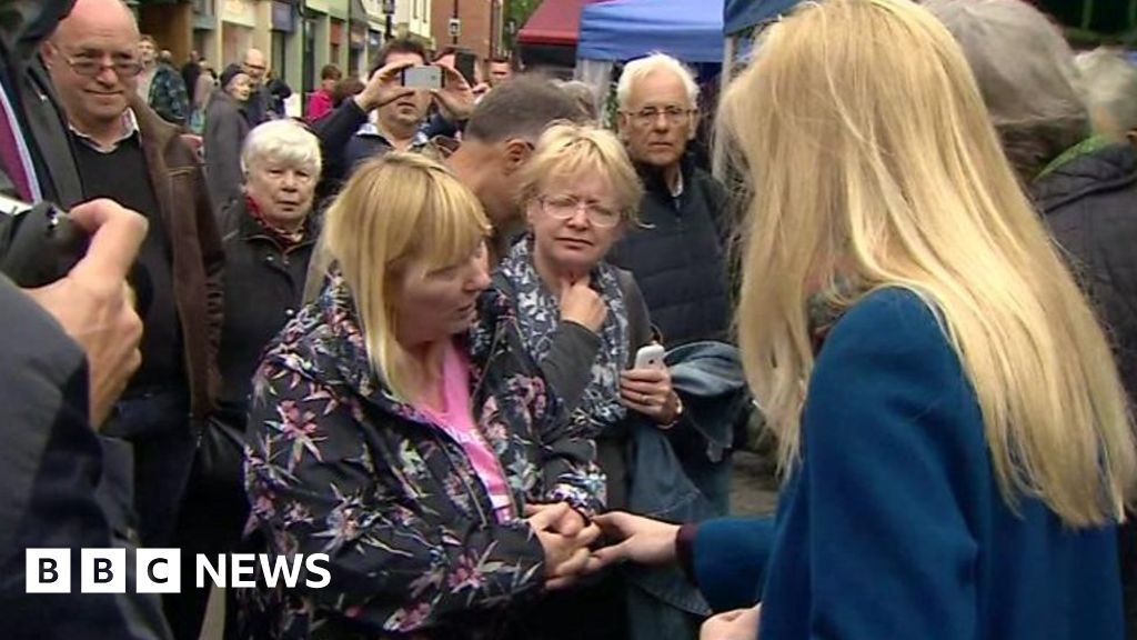 Woman tells Theresa May: I'm angry because I've no carer - BBC News