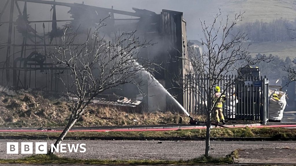 Fire crews tackle blaze at Rhymney recycling factory - BBC News