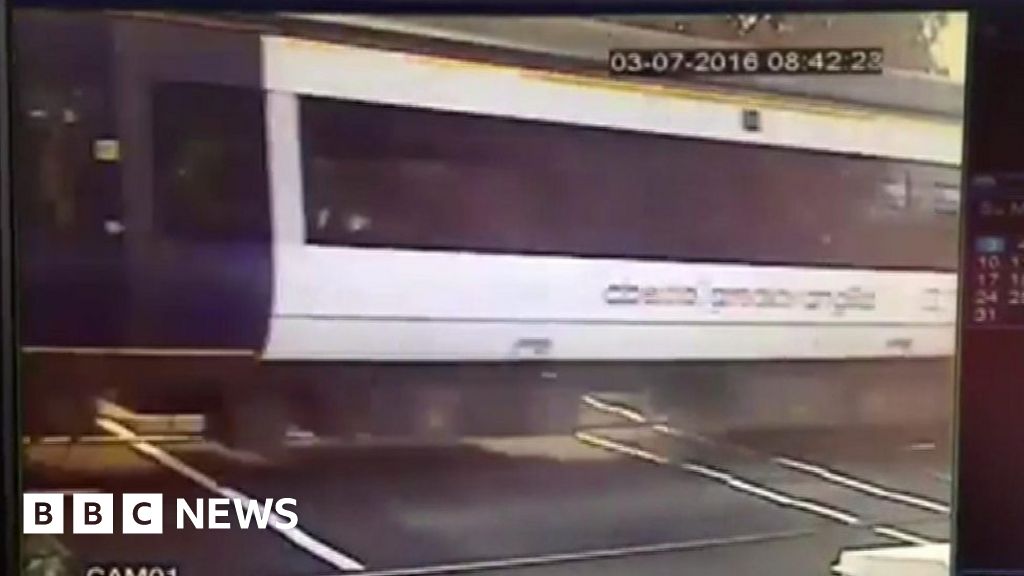 Man and child in 'shocking' near-miss at level crossing - BBC News