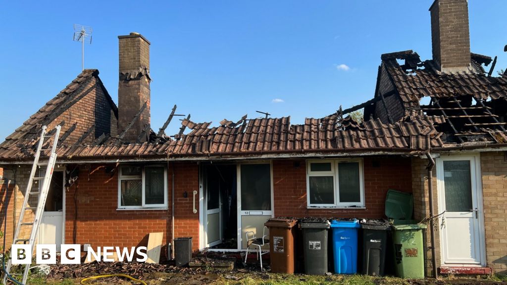 Crews battle 'devastating fire' at Corby bungalows - BBC News