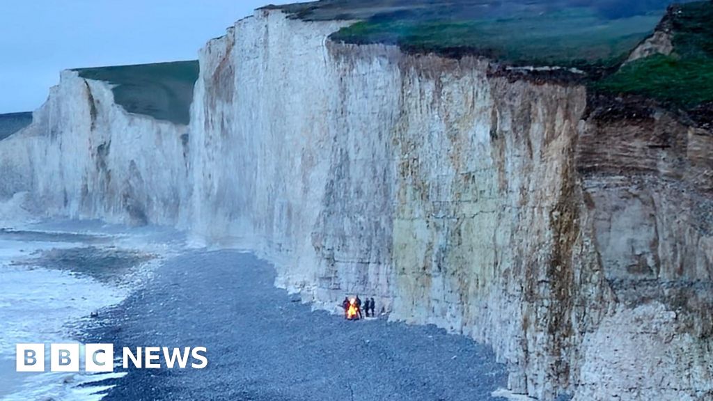 Birling Gap: Fire lit on beach at base of crumbling cliff - BBC News
