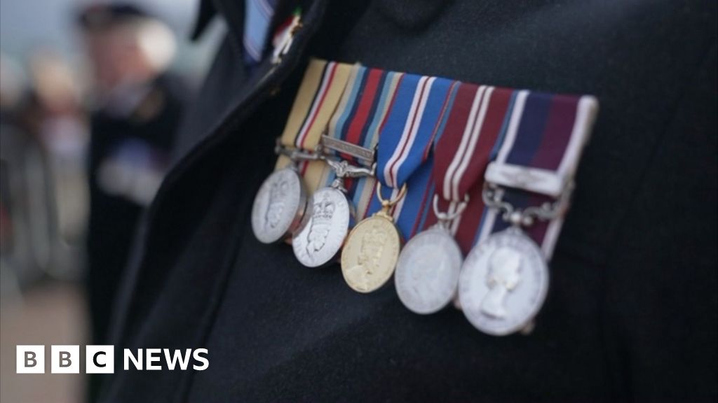 Man caught on camera dressed as fake navy admiral in Llandudno - BBC News