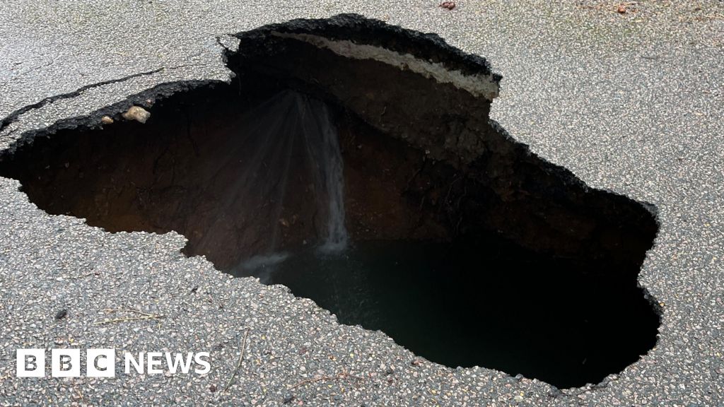 Water-filled sinkhole appears on residential road in Harpenden