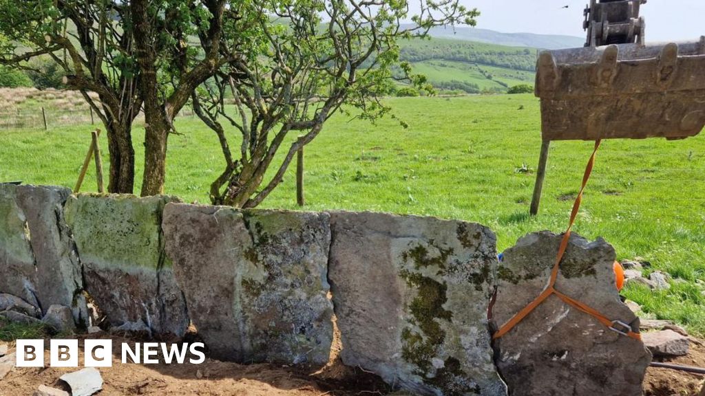 Rare slate fences restored in Lake District areas - BBC News