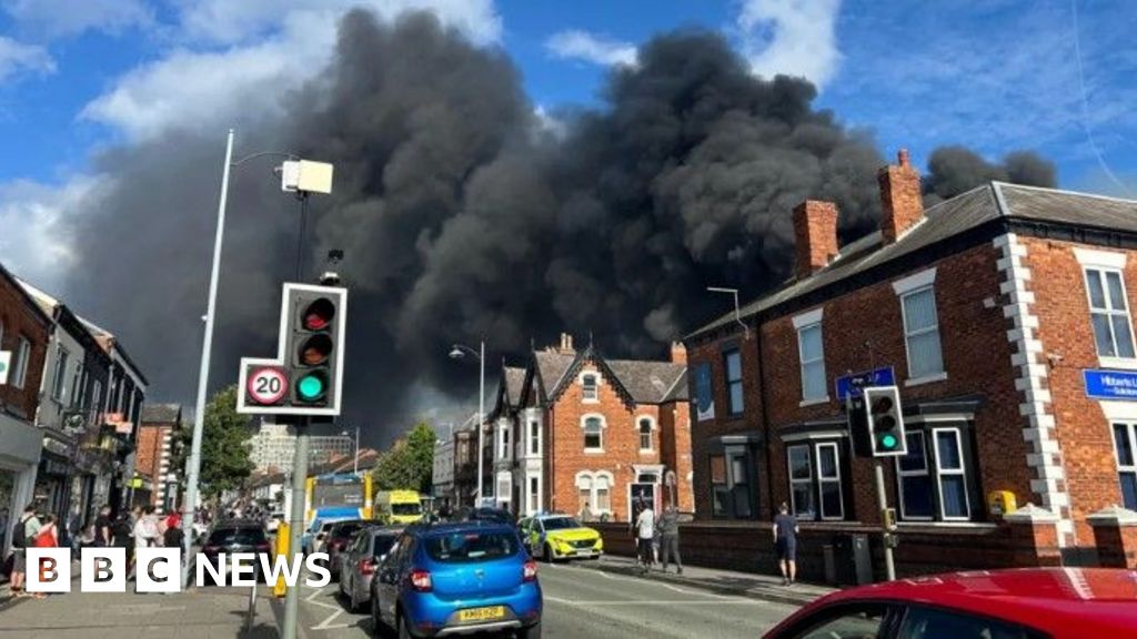 Trio charged with arson over Crewe printworks fire - BBC News