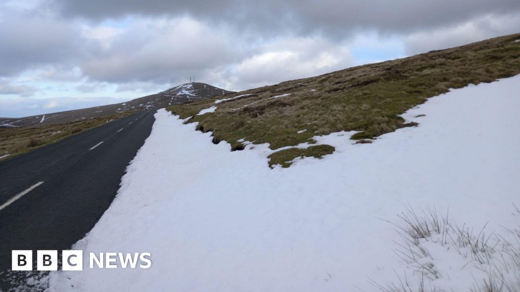 Roads on Manx mountain reopen after closure due to snow - BBC News