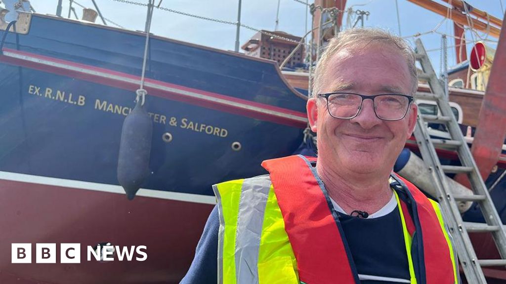 Shipwrecked lifeboat back on the water after 20-year restoration - BBC News