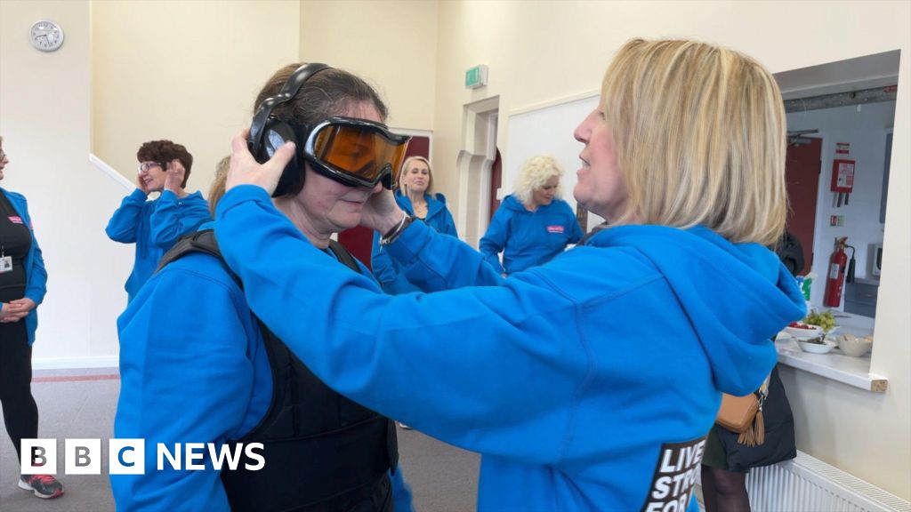 Age simulation suits help Derbyshire charity staff 'understand' - BBC News