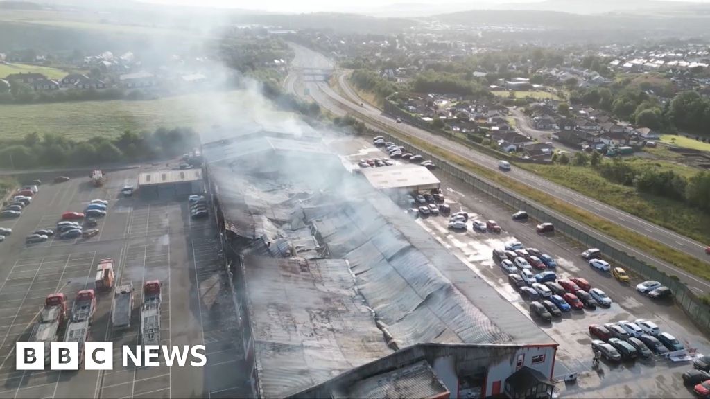Car dealership fire in Tredegar rips through building