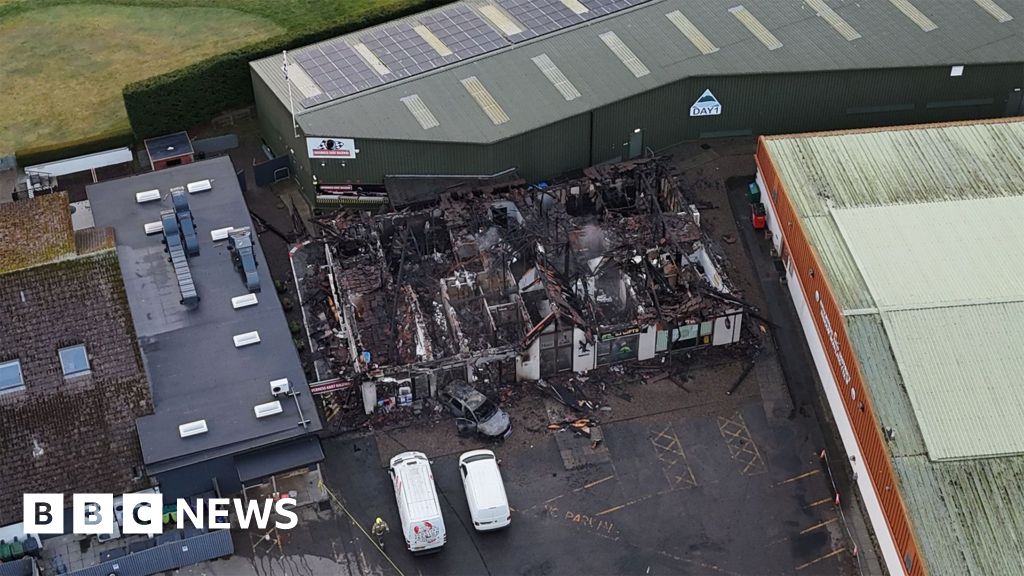 Footage shows damaged buildings after deliberate car fire - BBC News
