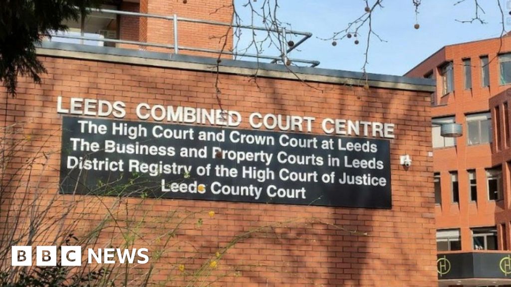 Leeds activist denies anti-immigration stickers were race-hate - BBC News