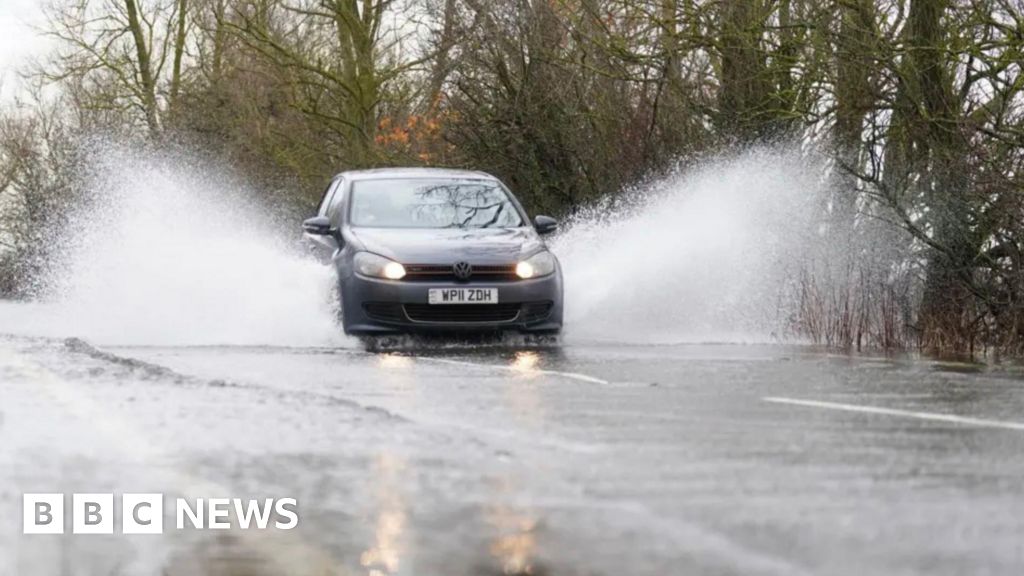 Drivers urged to take care as heavy rain causes flooding - BBC News