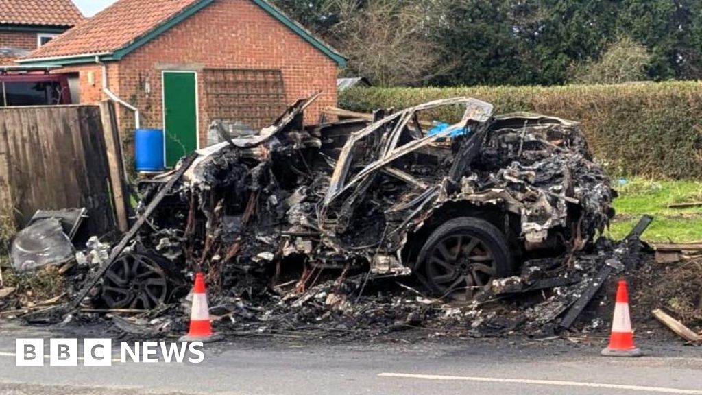 Police seal off burnt-out car after East Tuddenham crash