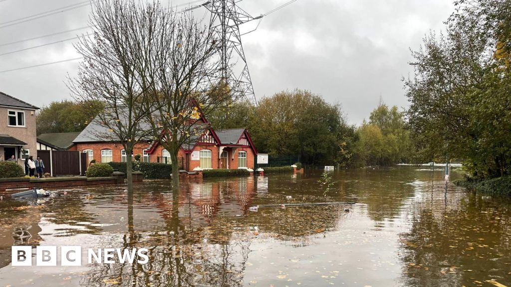 Burst water pipe floods road and buildings and cuts off supplies - BBC News