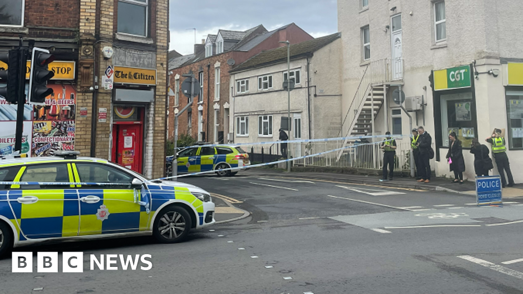 Gloucester assault: Man in hospital and woman arrested - BBC News