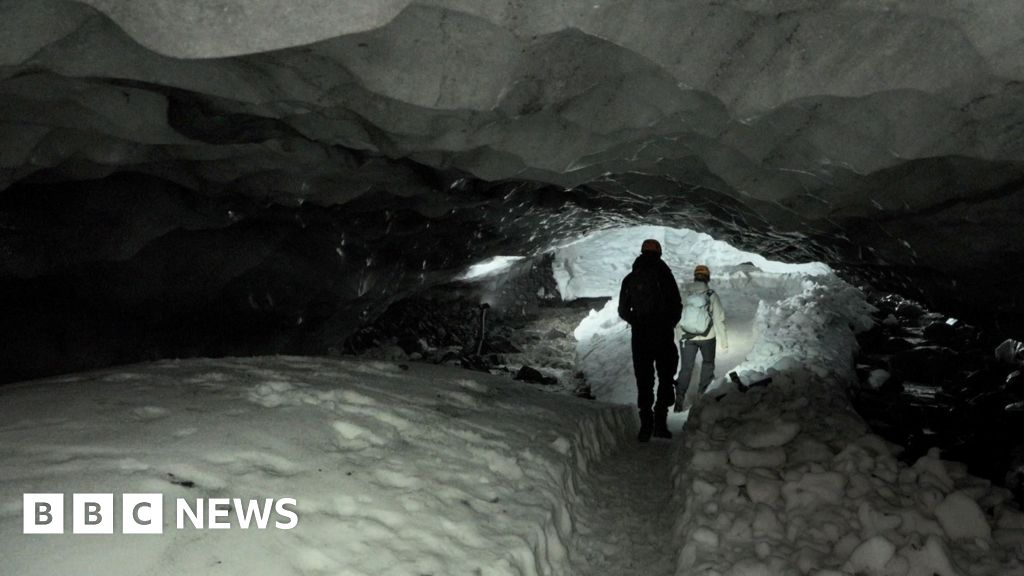 Inside an ice cave… on top of a volcano - BBC News