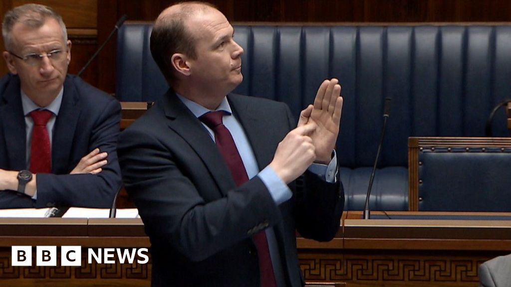 Communities Minister Gordon Lyons introduces bill in sign language ...