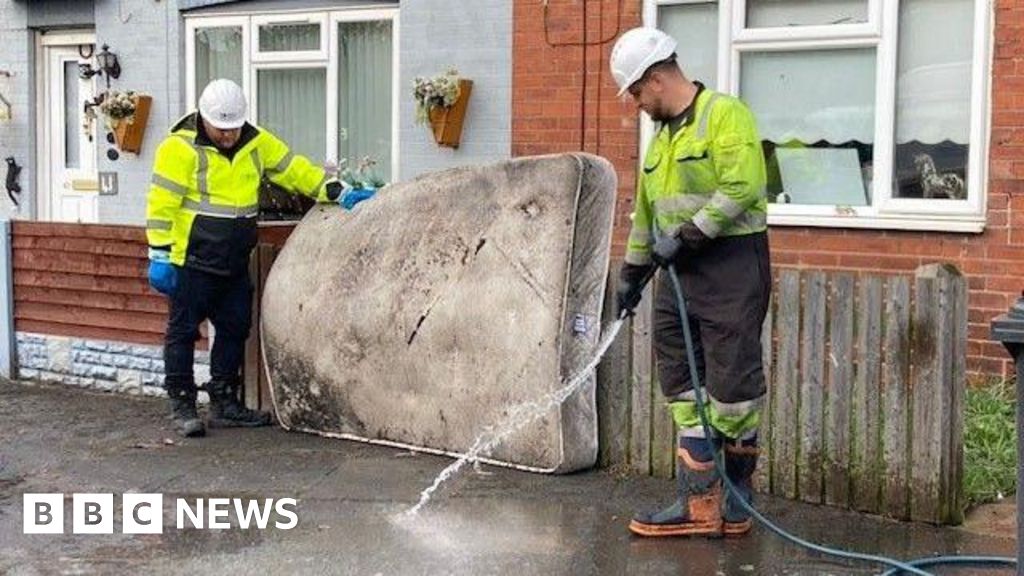 Bootle floods: Floods leave woman's sofa 'floating' in house - BBC News
