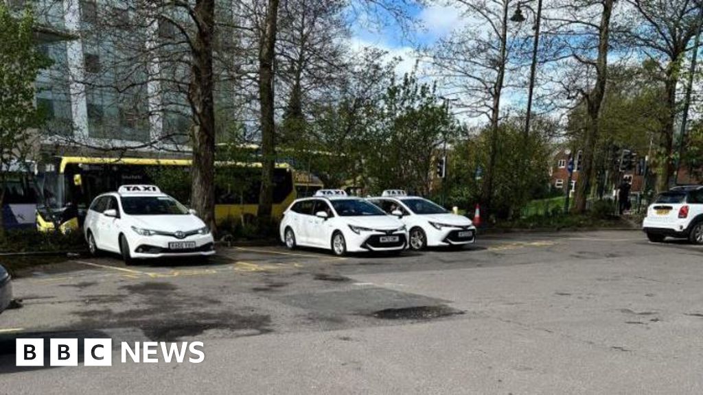 Oldham: Anger over taxis taking over disabled bays - BBC News