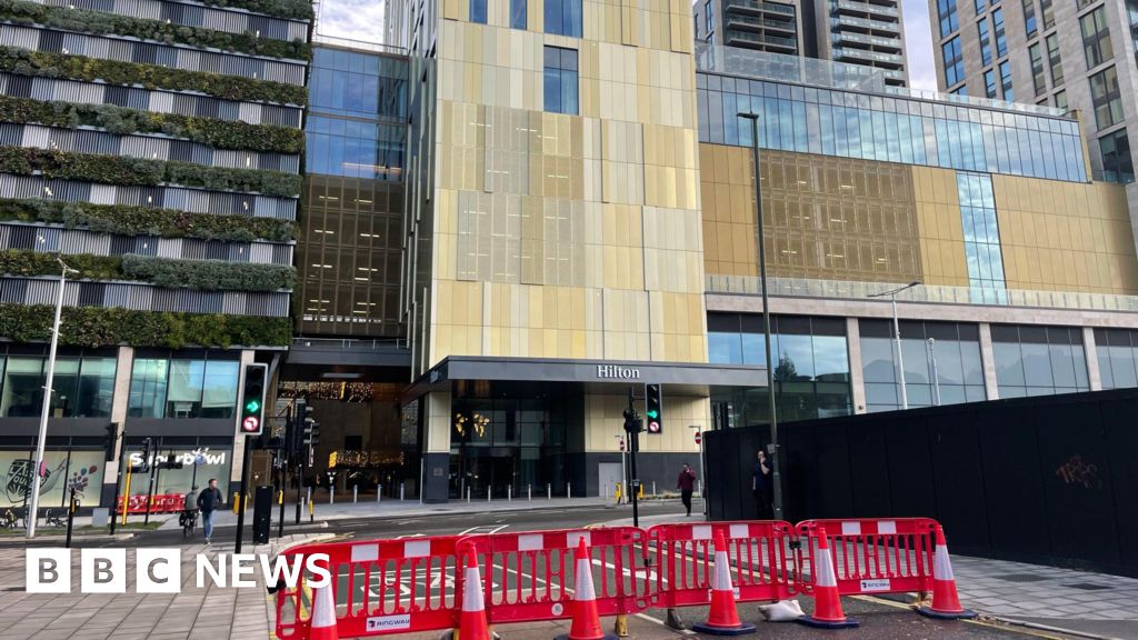 Cladding fell from Woking's Hilton hotel 'due to microclimate' - BBC News