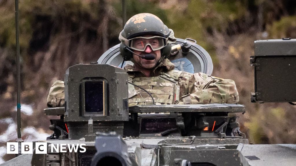 Prince William rides in tank during Estonia visit - BBC News