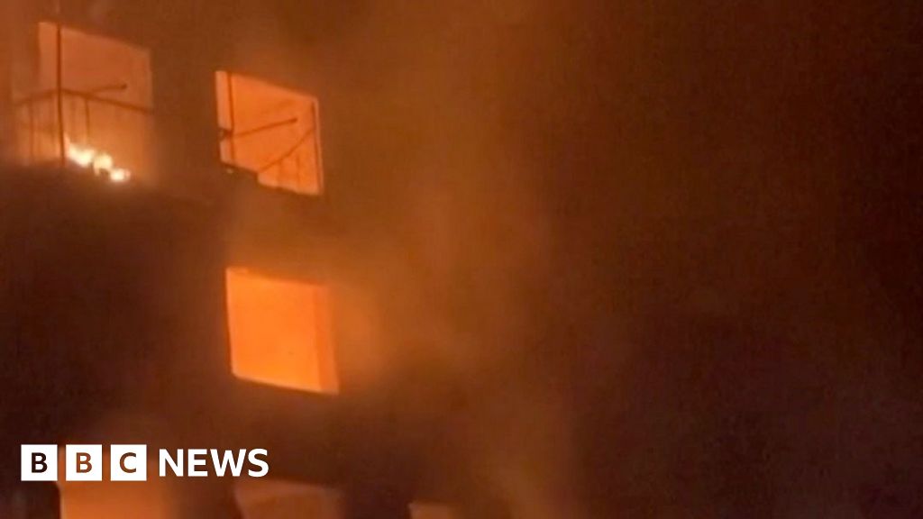 Flames rise from Ukrainian buildings after Russian strike - BBC News