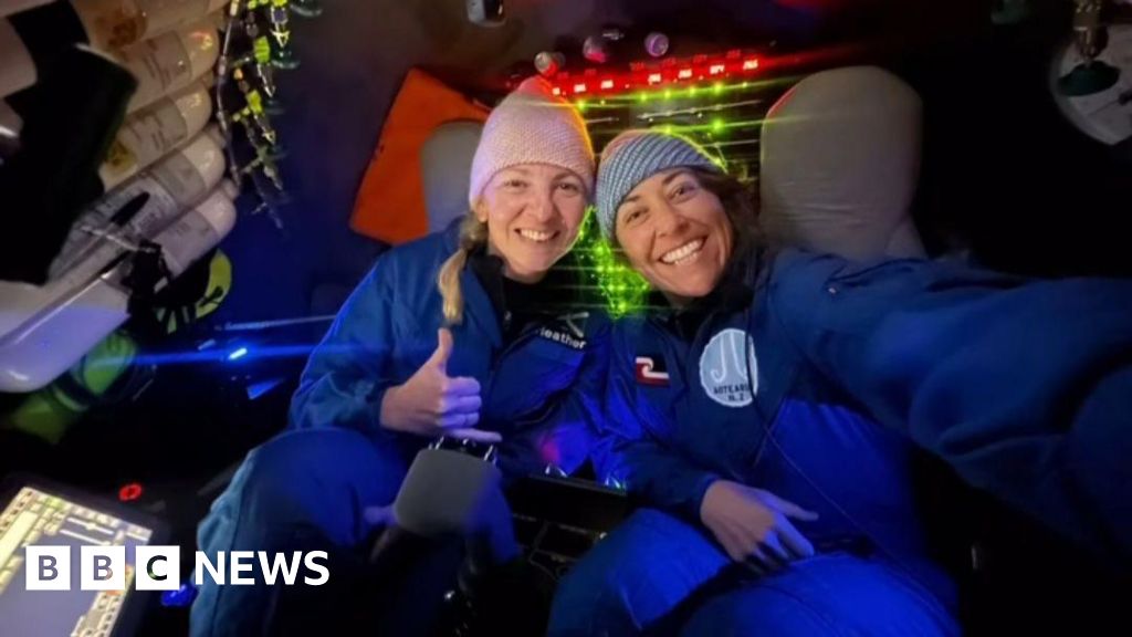 Woman breaks world record in deepest dive by all-female-crew - BBC News