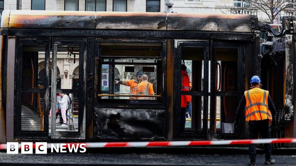 Dublin riots: Man, 61, charged with burning Luas tram