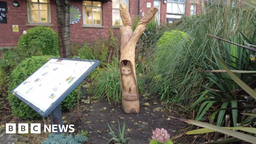 Whitwell: Tree transformed into sculpture gets 'forever home' - BBC News