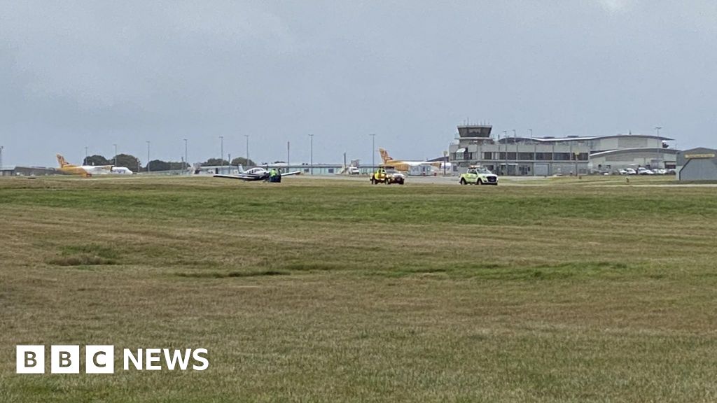 Airport runway temporarily closed after plane tyre bursts - BBC News