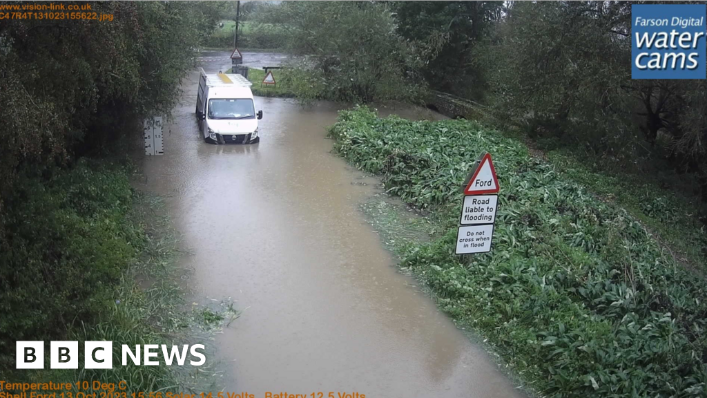Two men rescued from van stuck in Shell Ford flood water - BBC News