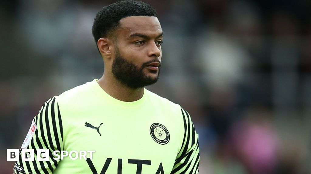 Ryan Johnson: AFC Wimbledon sign defender after Stockport exit - BBC Sport