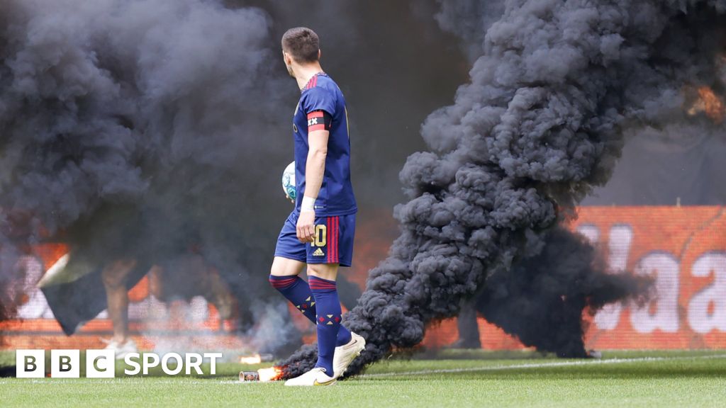 FC Groningen v Ajax called off as fans throw fireworks on to pitch - BBC Sport